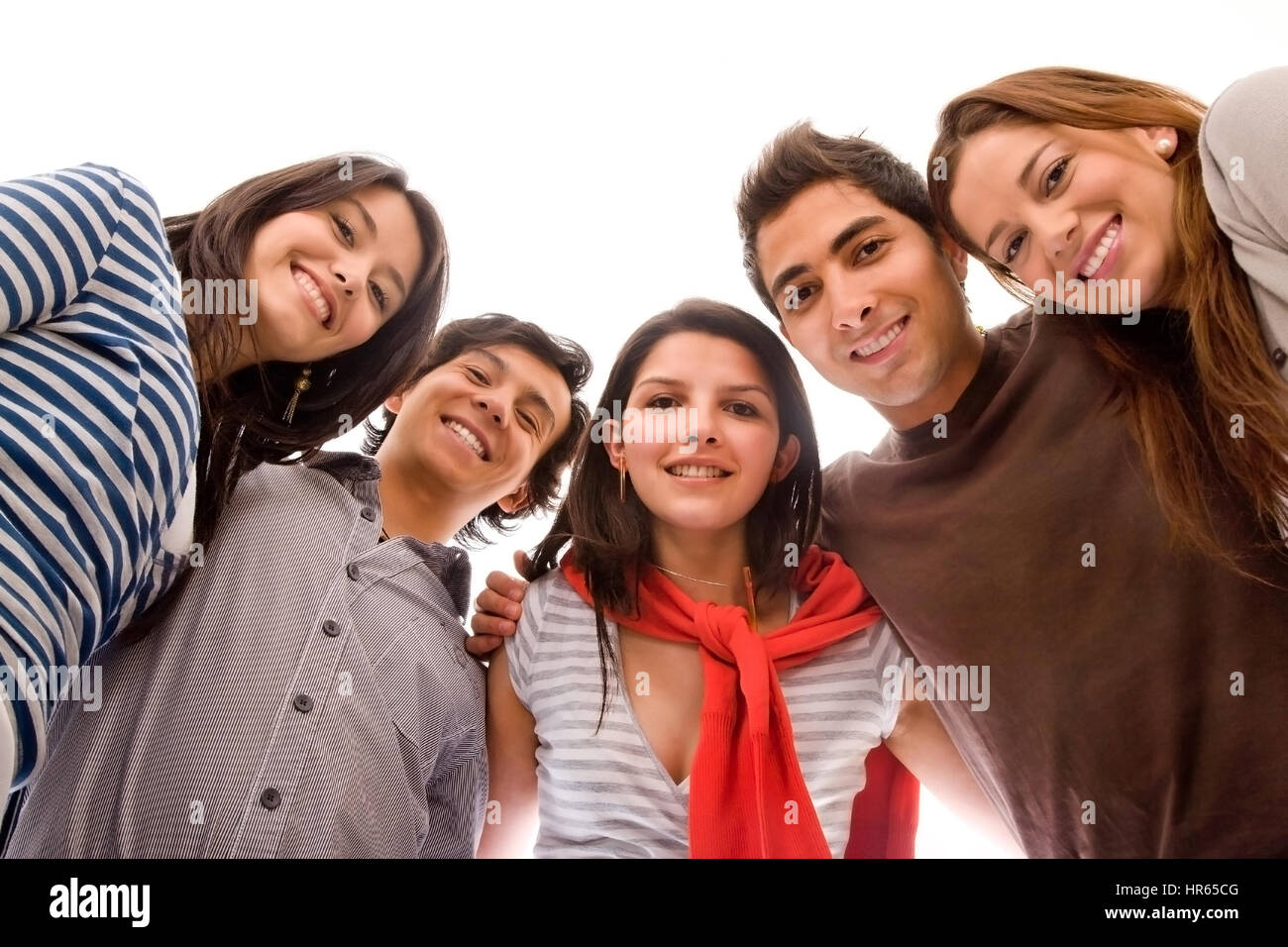 Low view of a group of happy people isolated on a white background ...