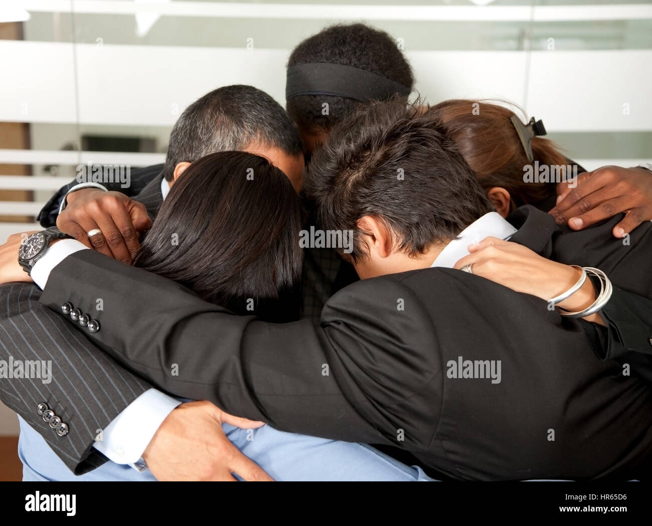 Team hugging hi-res stock photography and images - Alamy