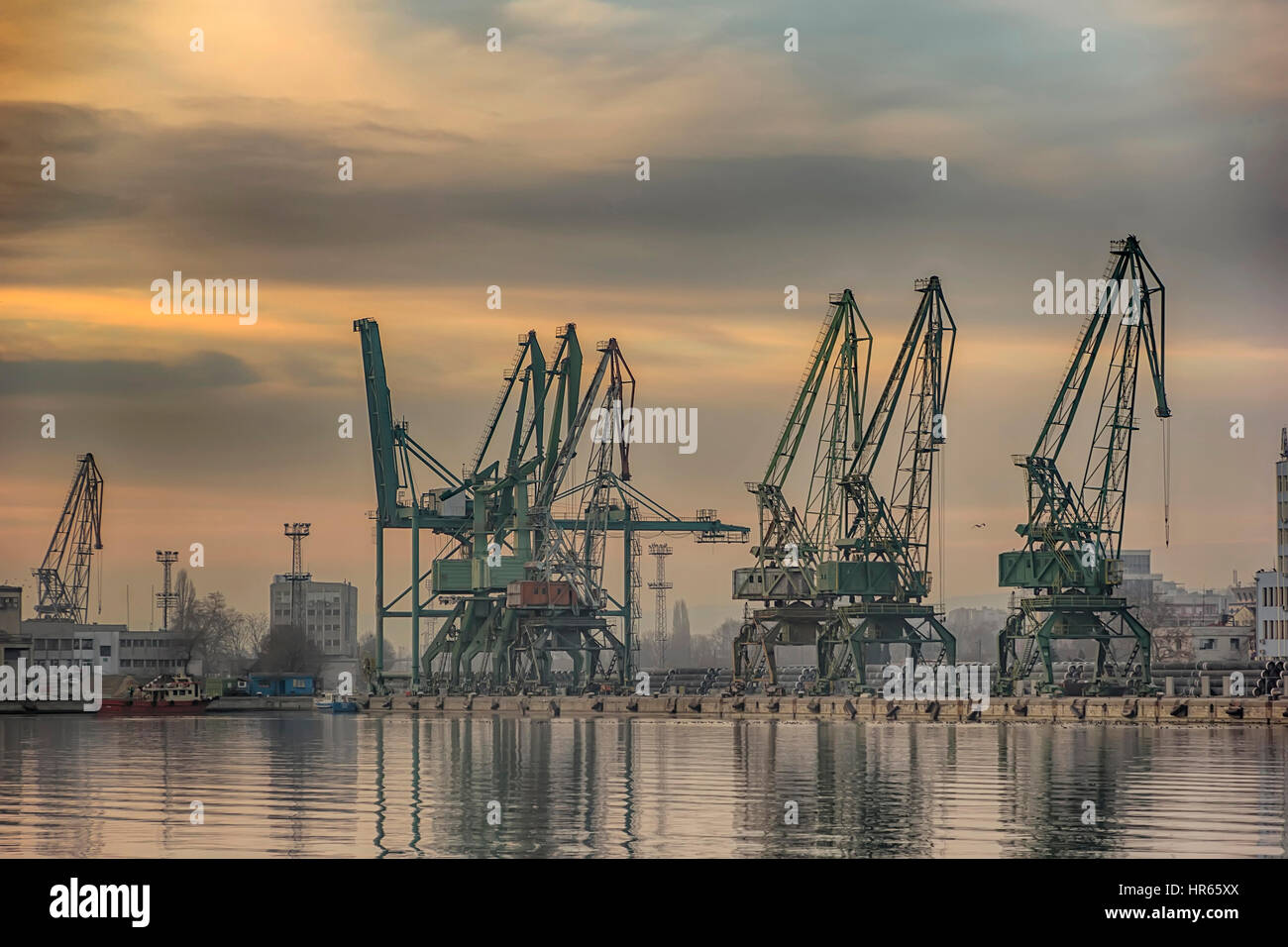 In the evening, the silhouette of port cranes.Ready to load containers ...