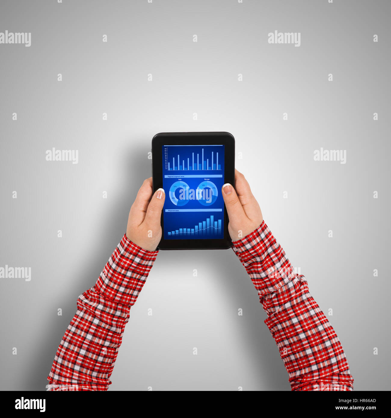 Top view of girl hands using tablet pc with diagrams and graphs on ...