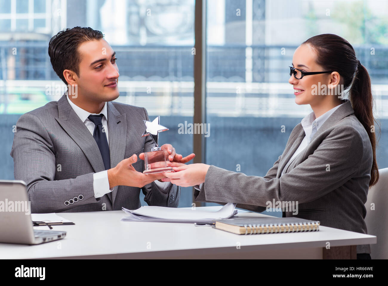 Businesspeople receiving award prize in office Stock Photo - Alamy