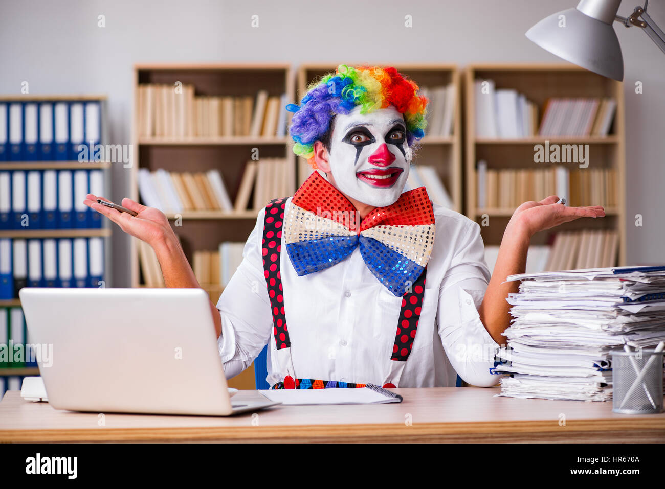 Clown businessman working in the office Stock Photo - Alamy