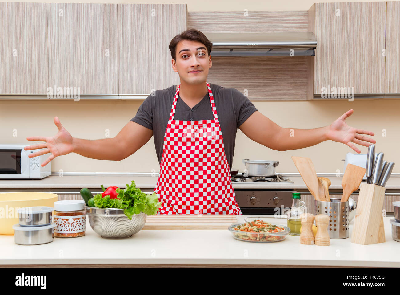 Man male cook preparing food in kitchen Stock Photo - Alamy