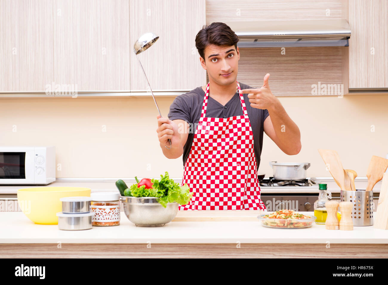 Man male cook preparing food in kitchen Stock Photo - Alamy