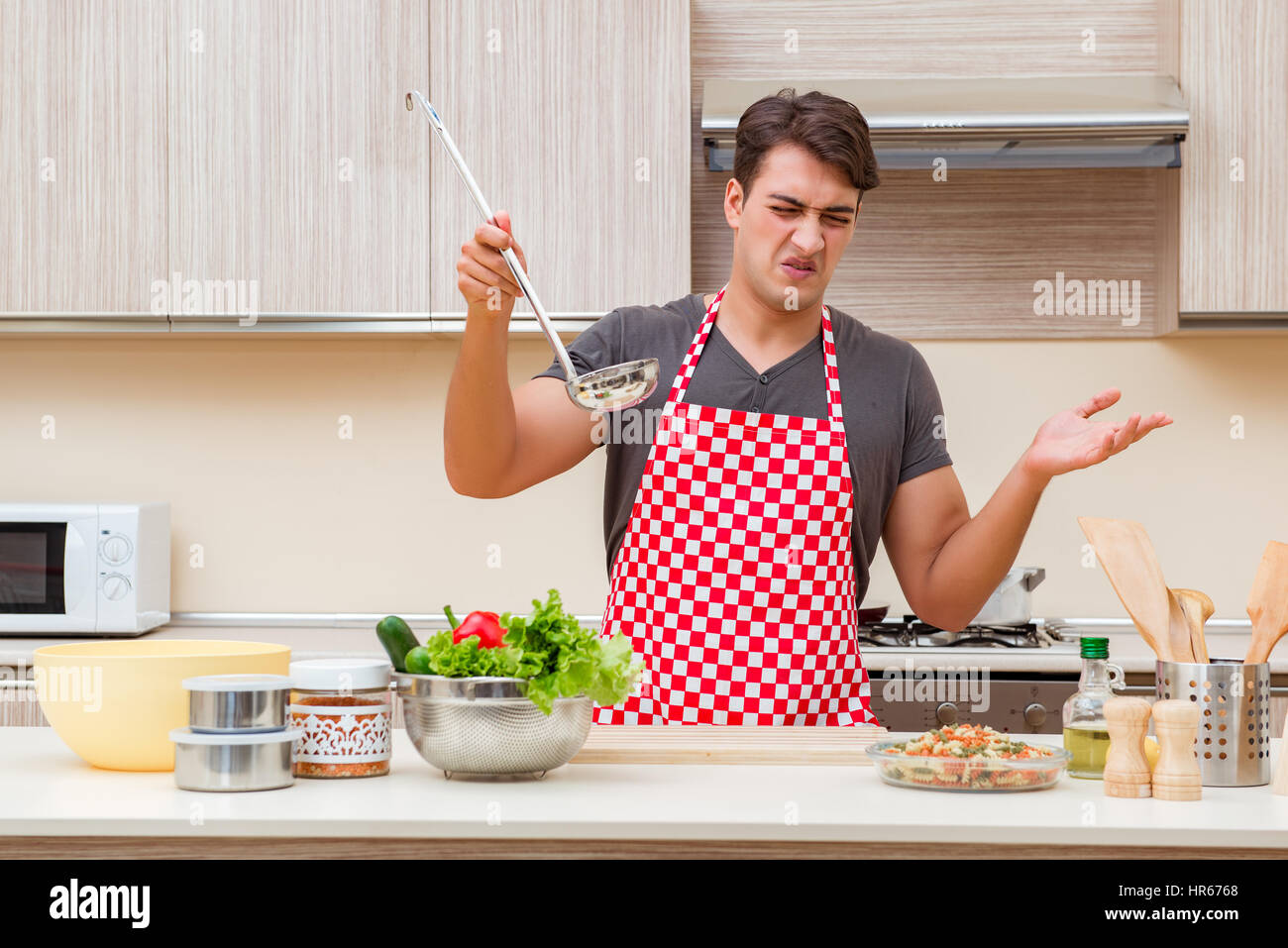 Man male cook preparing food in kitchen Stock Photo - Alamy