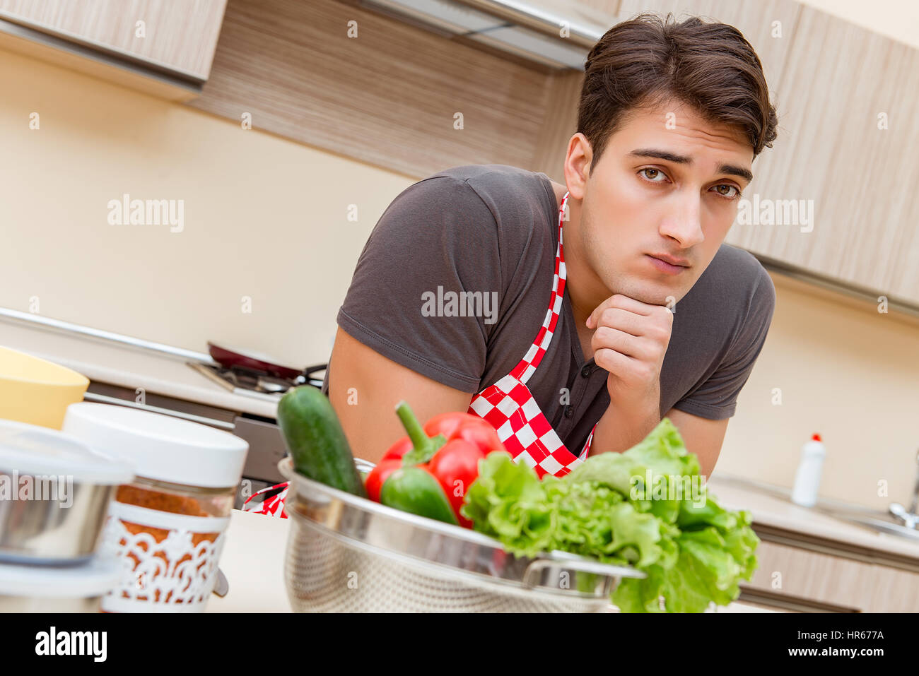Man male cook preparing food in kitchen Stock Photo - Alamy