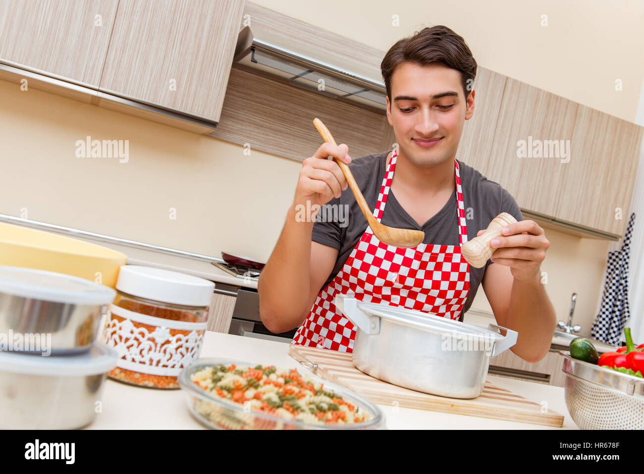 Man male cook preparing food in kitchen Stock Photo - Alamy