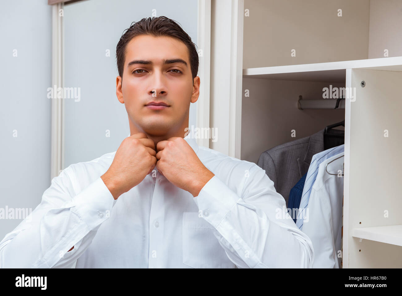 Businessman dressing up for work Stock Photo - Alamy