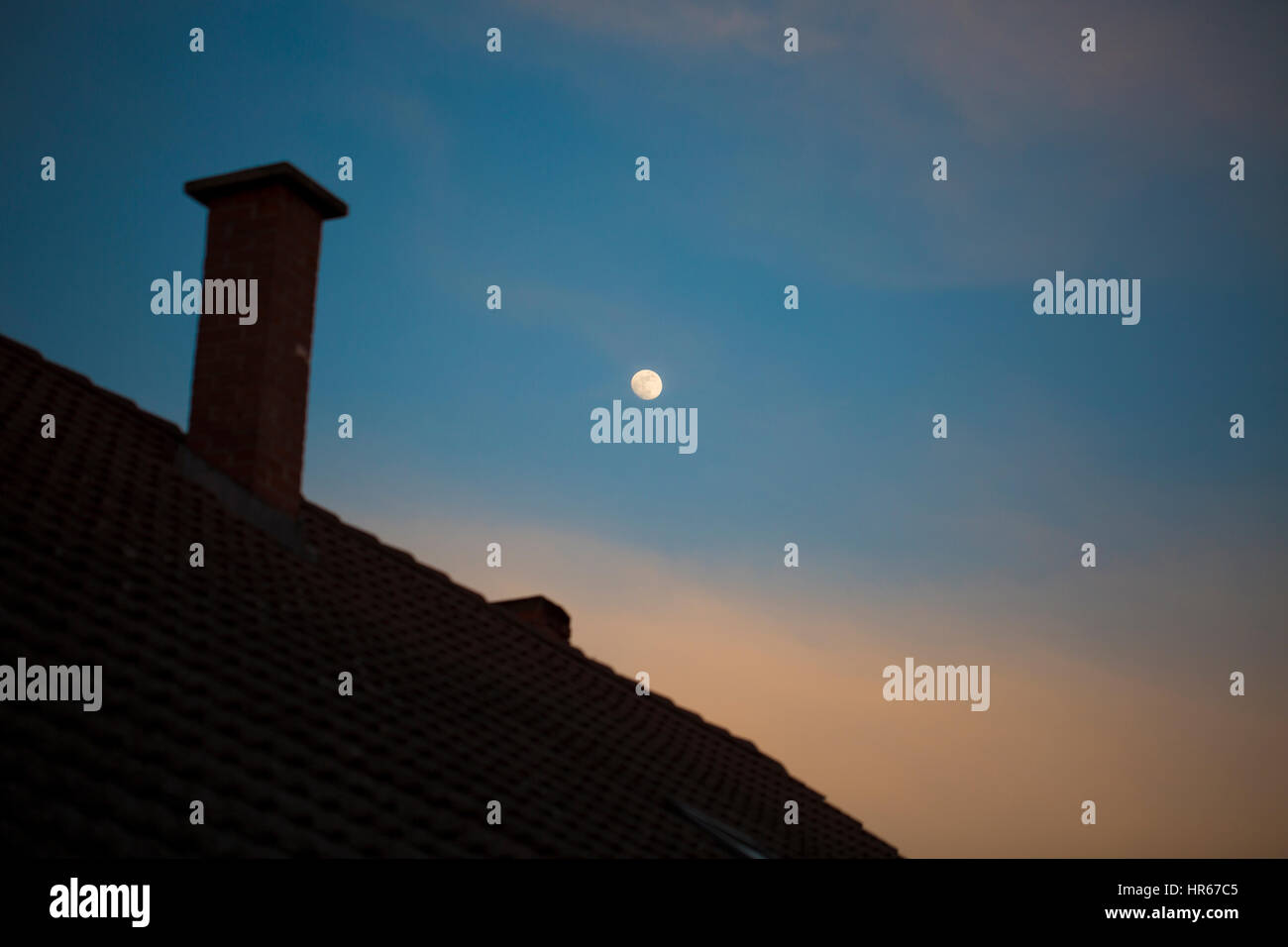 Moon over house Stock Photo - Alamy