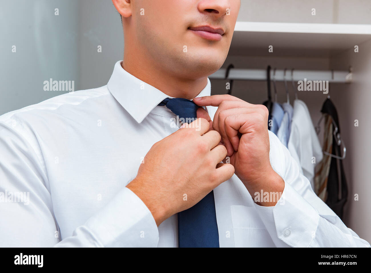 Businessman dressing up for work Stock Photo - Alamy
