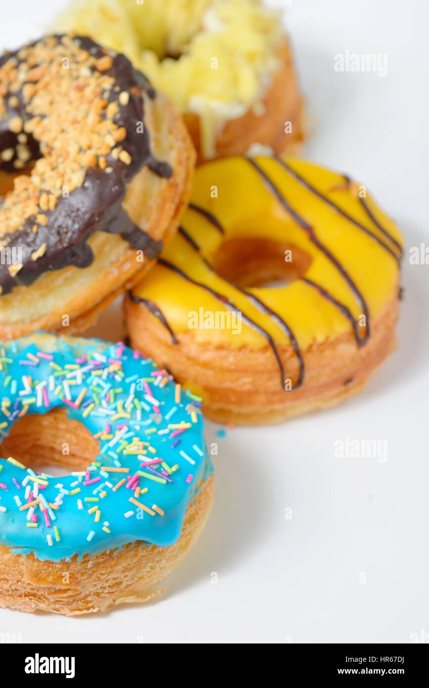 Different Types of Donuts on white table Stock Photo - Alamy