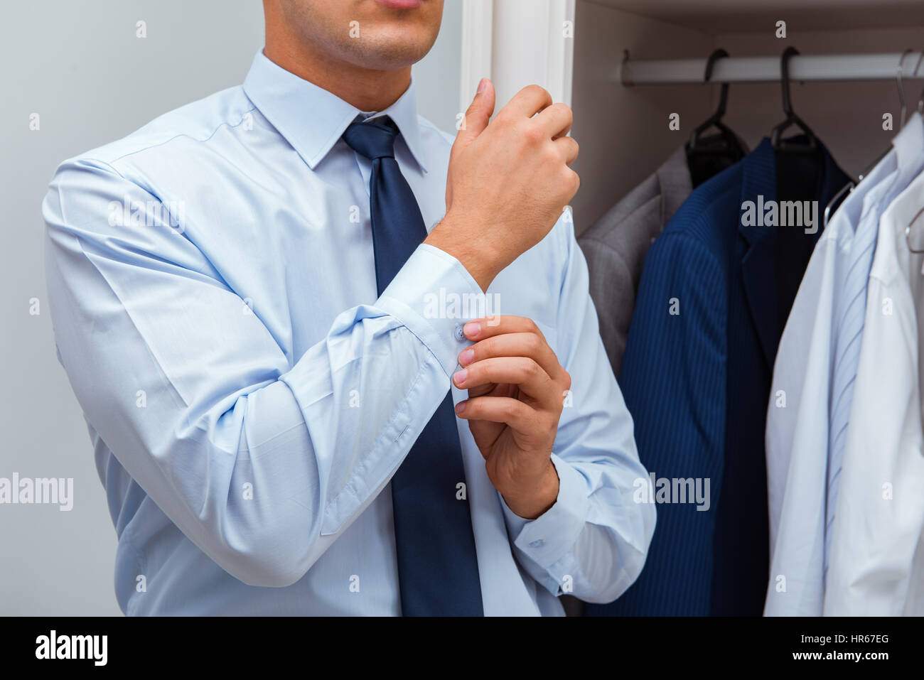 Businessman dressing up for work Stock Photo - Alamy