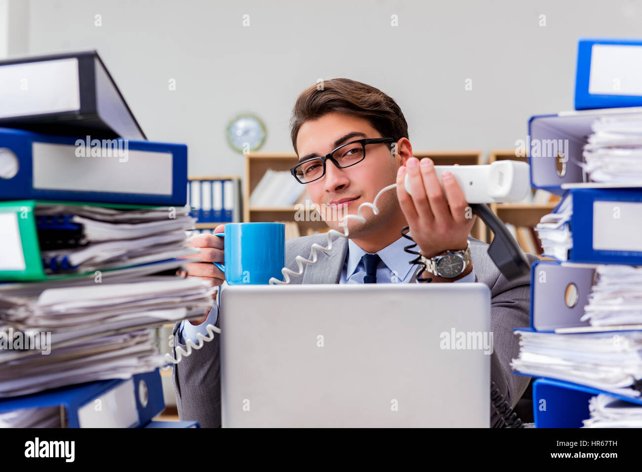 Busy businessman under stress due to excessive work Stock Photo - Alamy