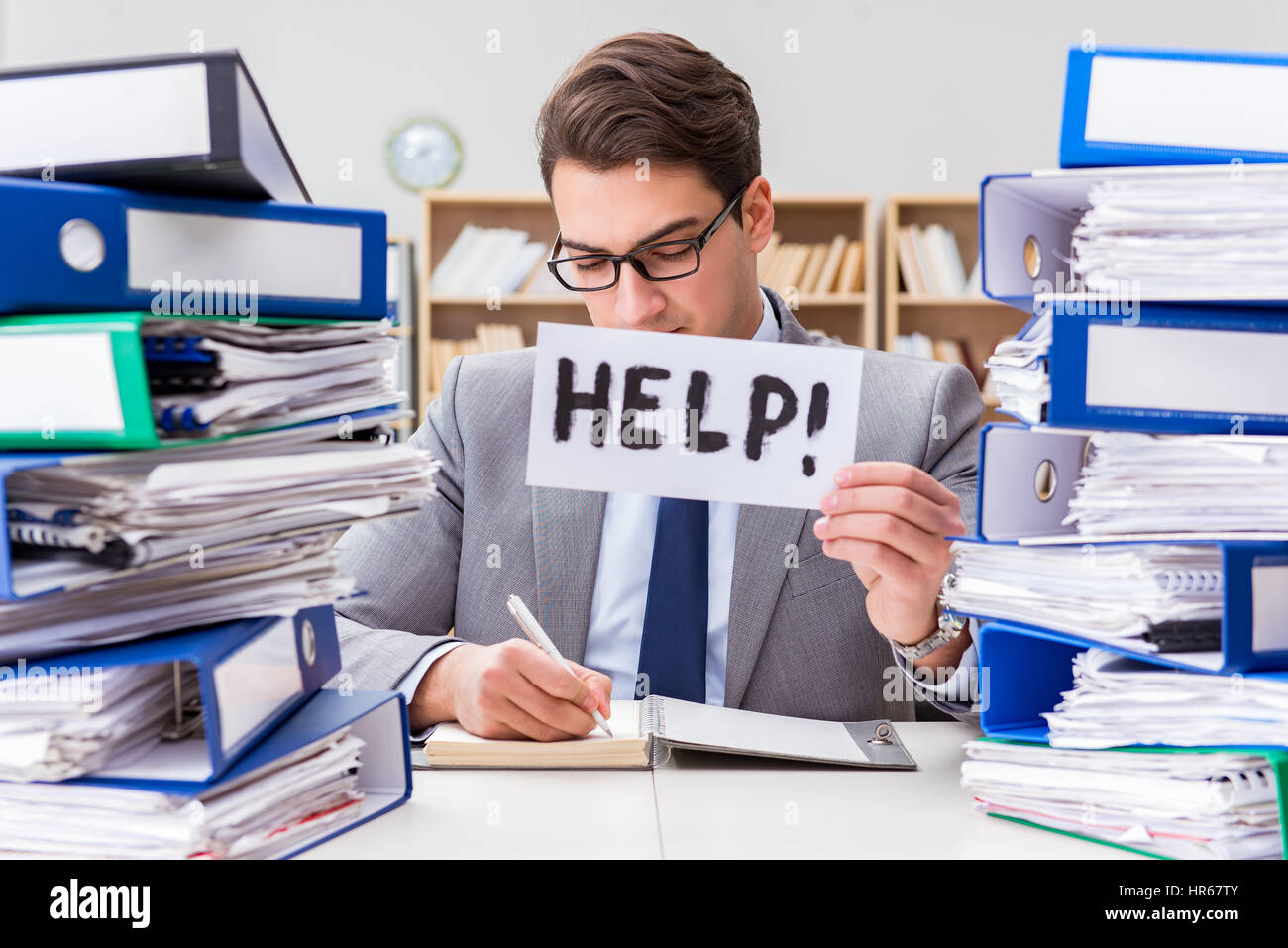 Busy businessman asking for help with work Stock Photo - Alamy