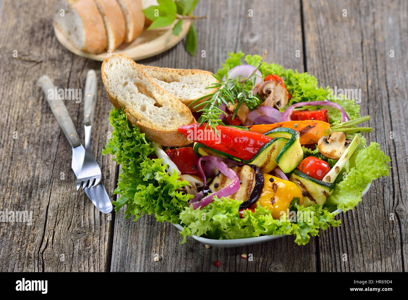 Mixed grilled vegetables on lollo bionda salad served with toasted ...