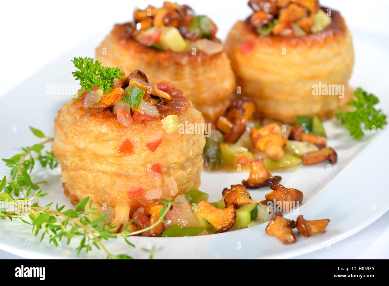 Puff pastry pie stuffed with zucchini vegetables with thickened sauce ...