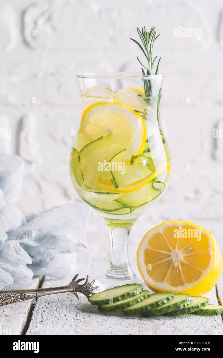 Cold and refreshing detox water with lemon and cucumber in a cocktail ...