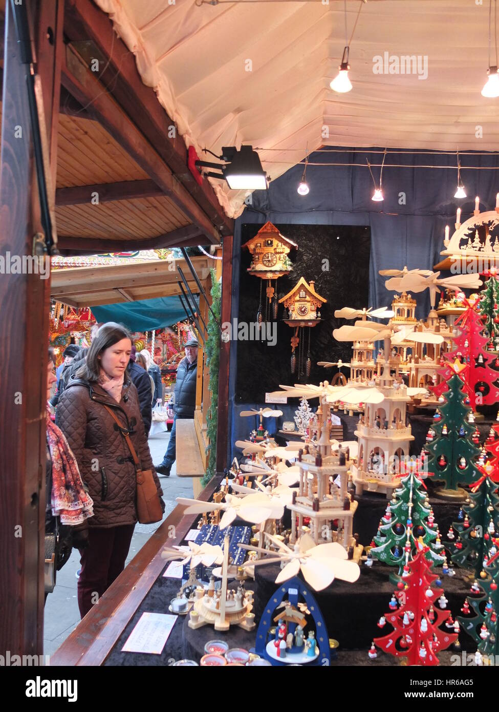 A stall selling traditional wooden sculptures and cuckoo clocks at ...