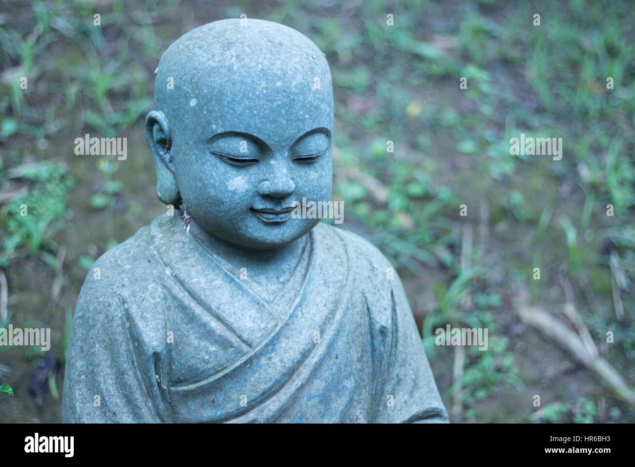 Buddhist Stone Statues Stock Photo - Alamy