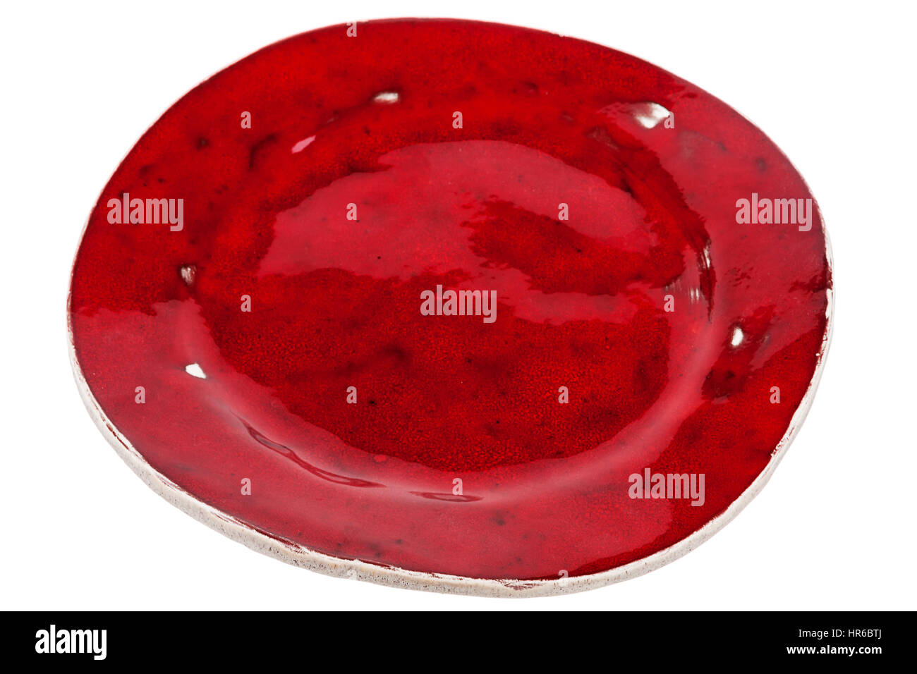 Red handmade pottery plate isolated on white background Stock Photo - Alamy