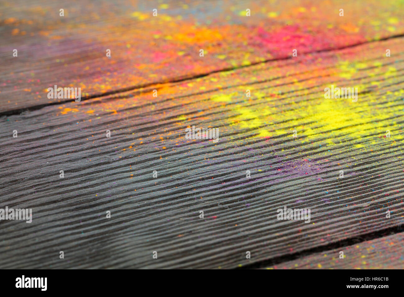 Holi colours on wood Stock Photo - Alamy