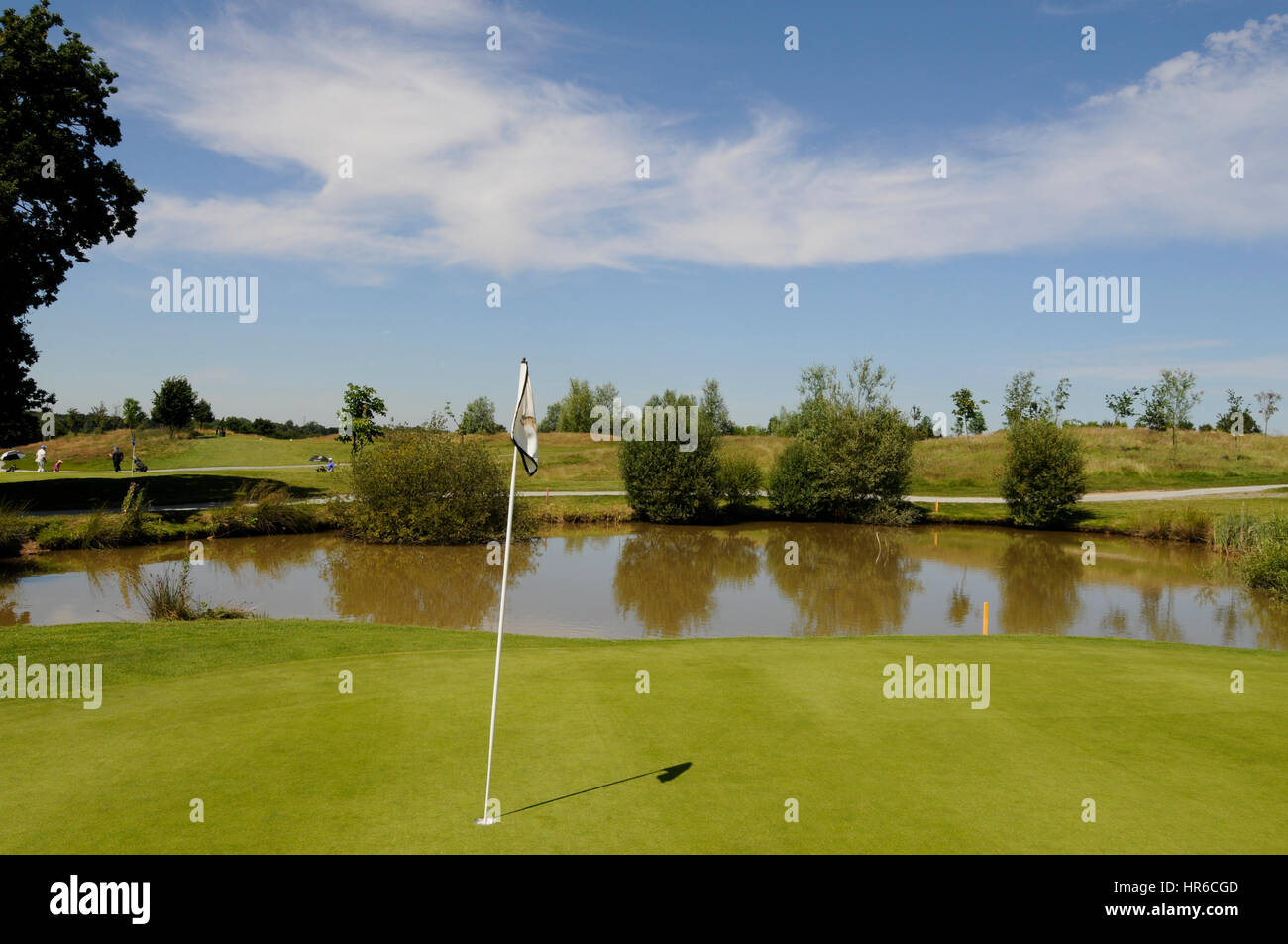 View of 1st Green with lake and 17th Green in the background, The Shire ...