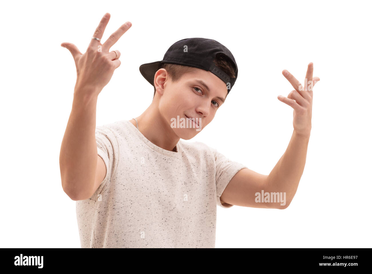Young handsome rap dancer in black baseball cap showing dance moves ...