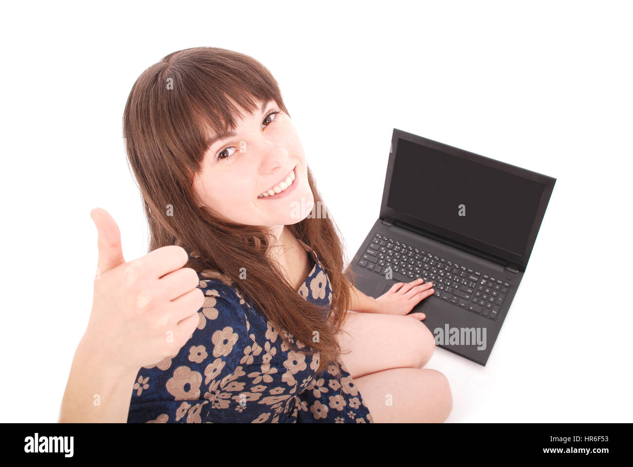 Laptop girl happy giving thumbs up success sign sitting at computer PC ...
