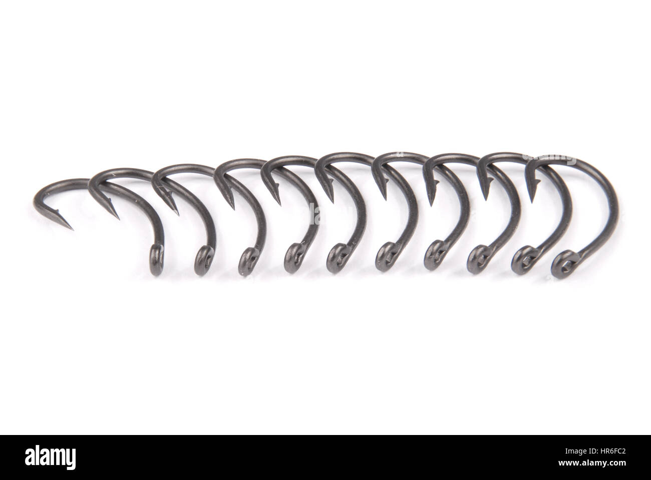 Sharp steel fishing hooks isolated on white background with soft shadow ...