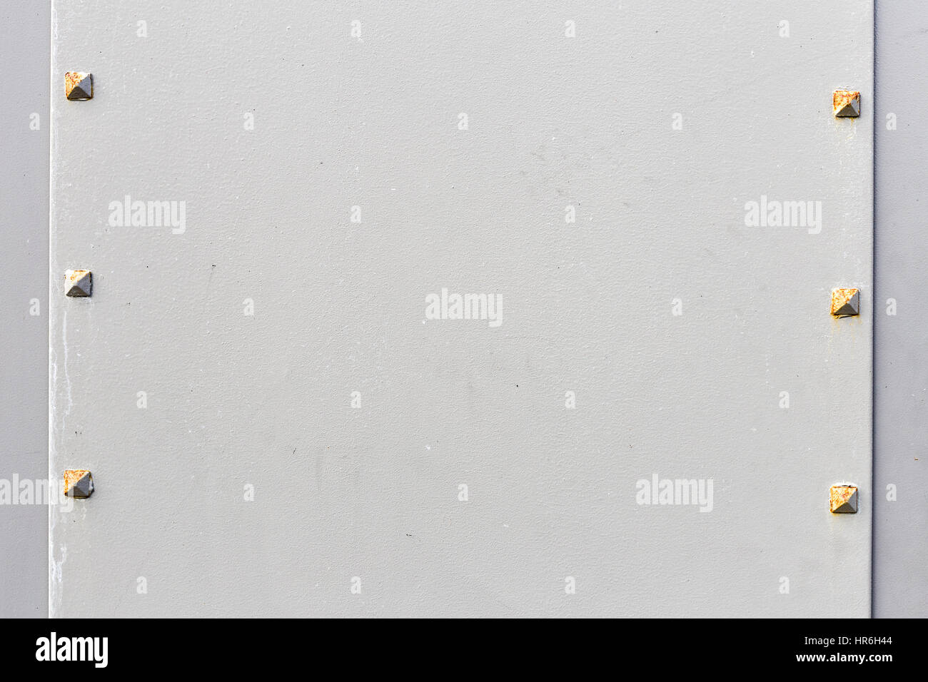 Metal plate with rivets Stock Photo - Alamy