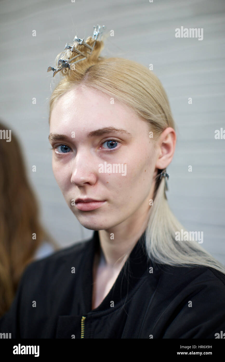 Milan. 27th Feb, 2017. A model prepares for Chinese designer brand ...