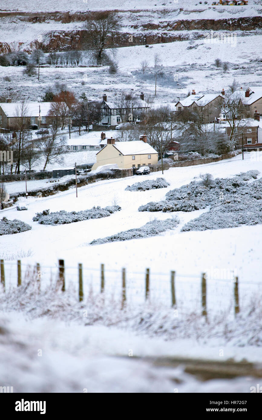 A welsh cottage surrounded by a snow covered landscape in rural Flintshire near to the village ...