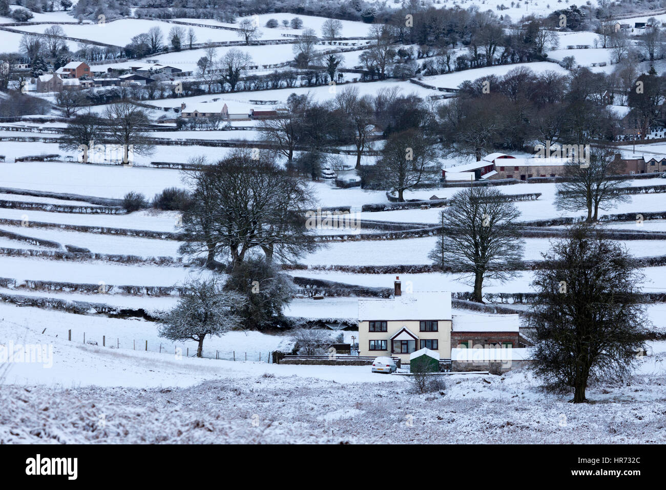 A snow covered rural farm house in the village of Rhes-y-Cae located in ...
