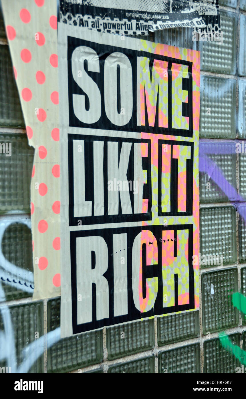 Some Like it Rich poster on a wall Stock Photo - Alamy