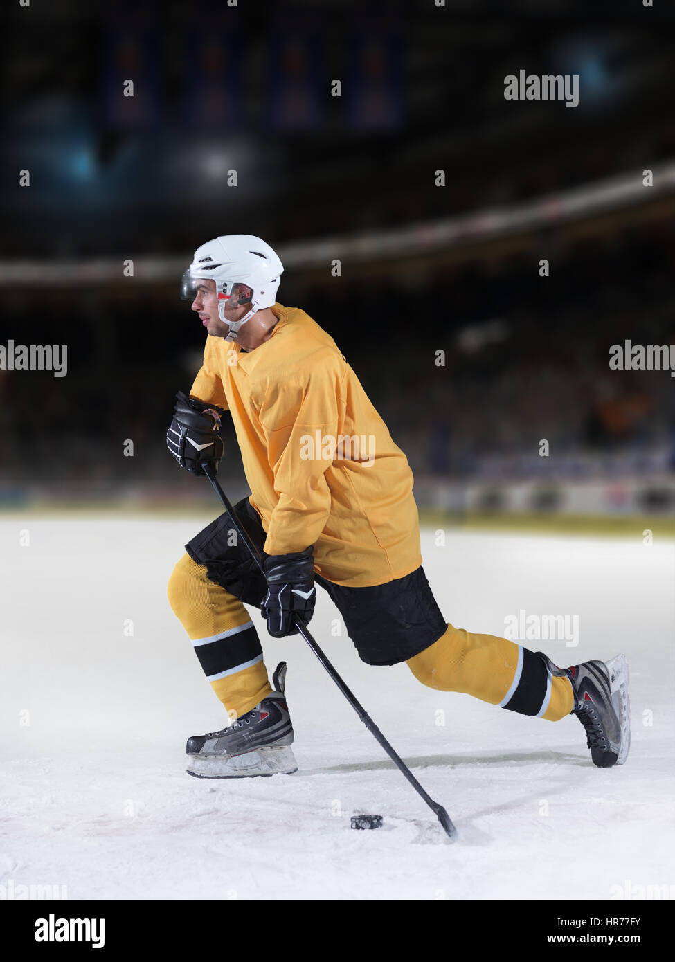 ice hockey player in action kicking with stick Stock Photo - Alamy