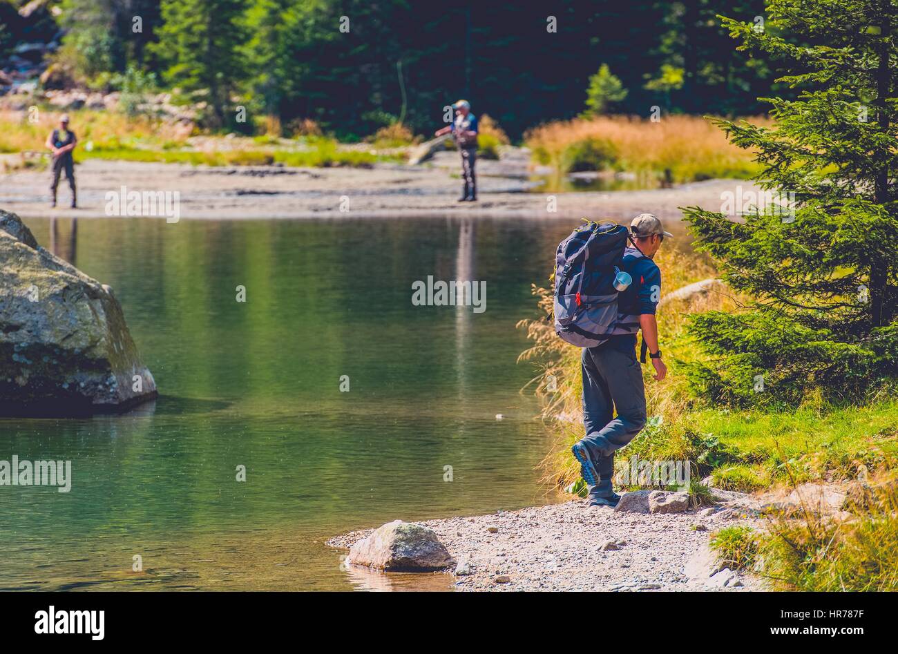 Traveling Adventurous Men on the Edge of Scenic Mountain Lake ...