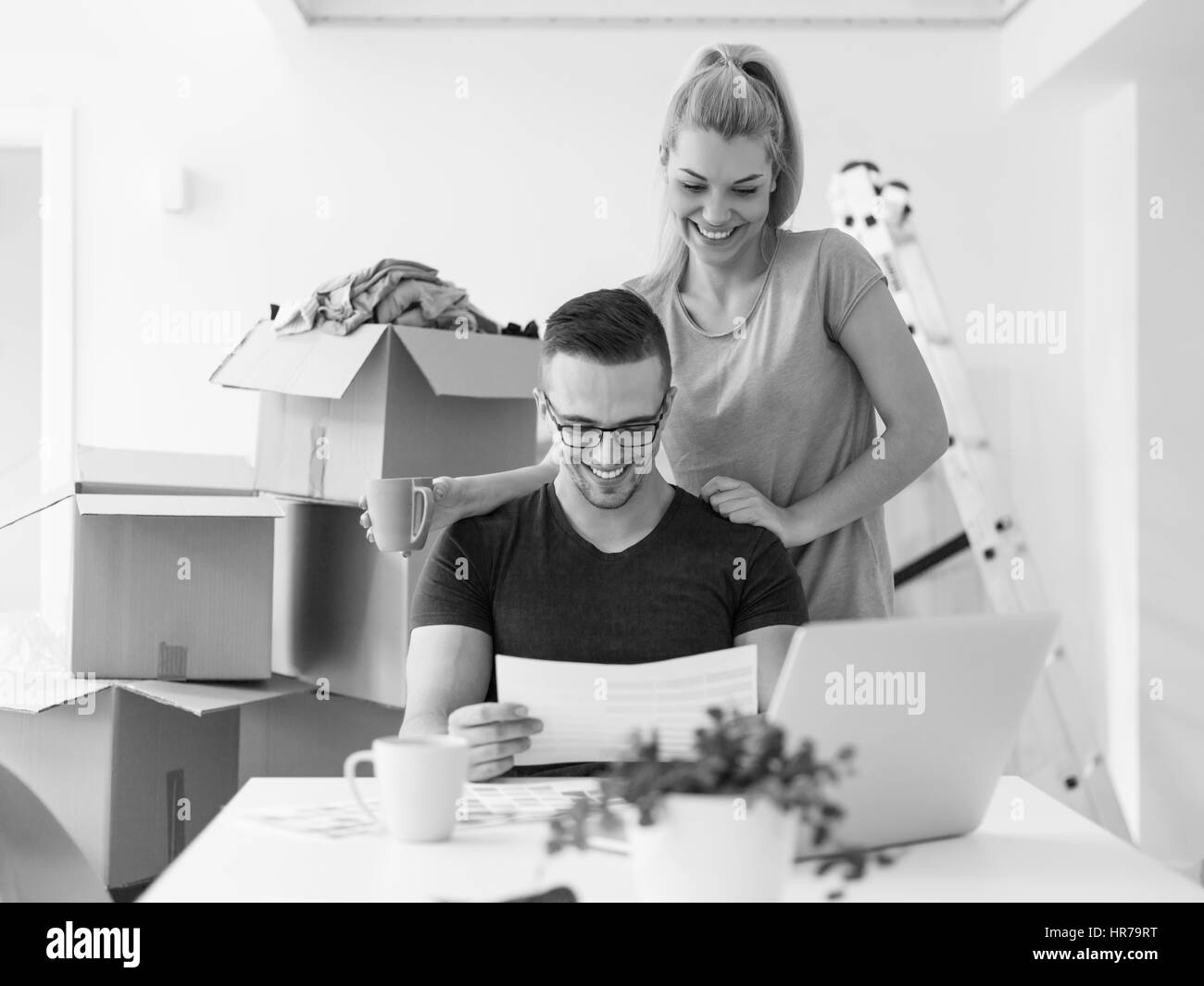 Smiling man using notebook Black and White Stock Photos & Images - Alamy