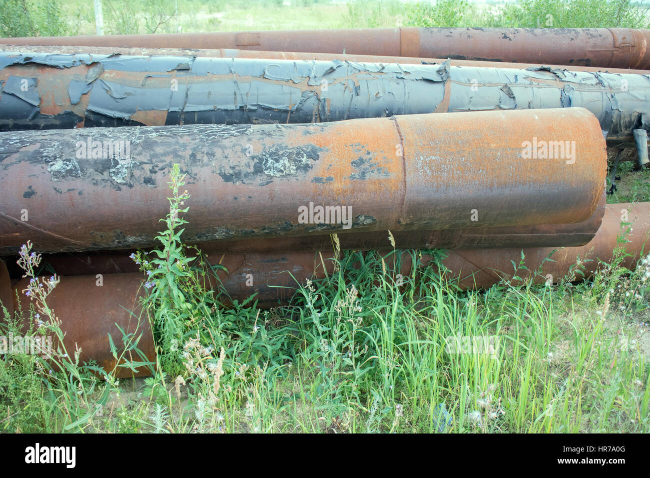 pipe engineering construction on sand. warehouse large pipes under open ...