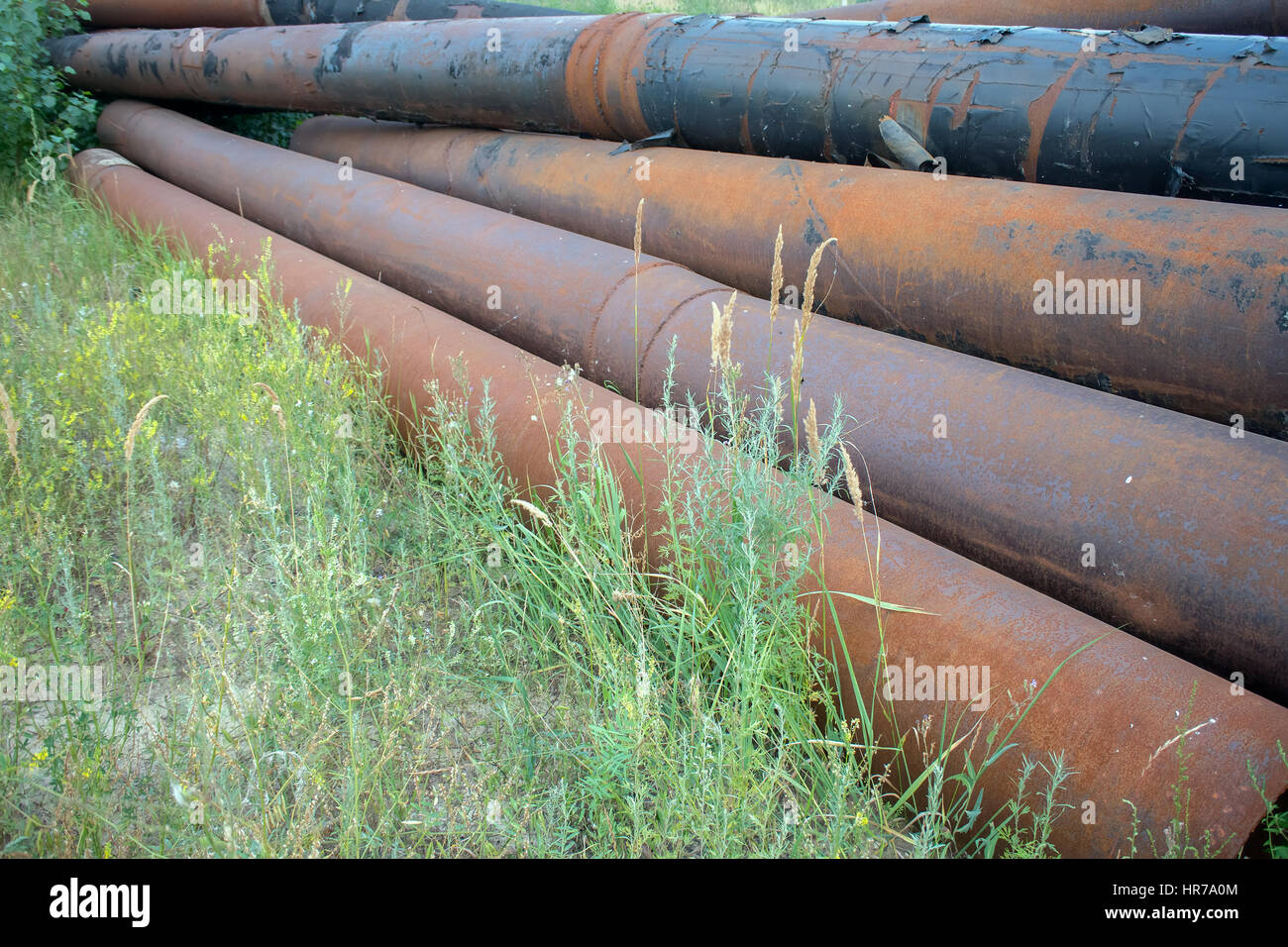 pipe engineering construction on sand. warehouse large pipes under open ...