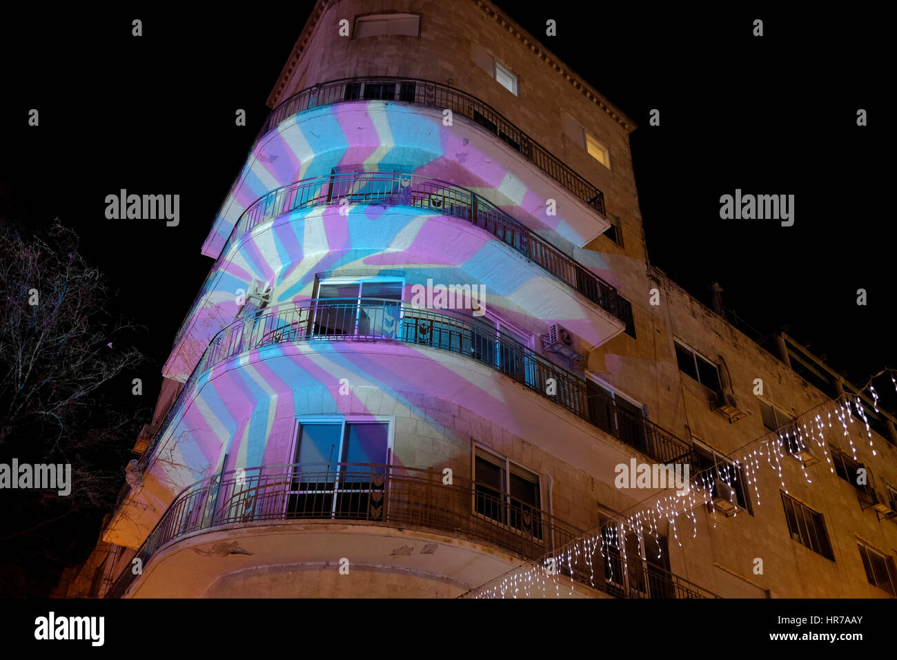 A light show projection over an old building built in Bauhaus ...