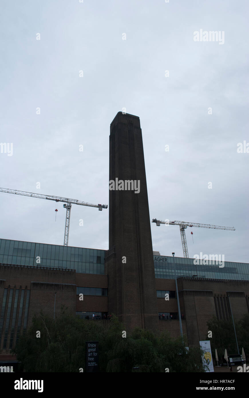 Dark central tower of Tate Modern art gallery, flanked by two tower ...