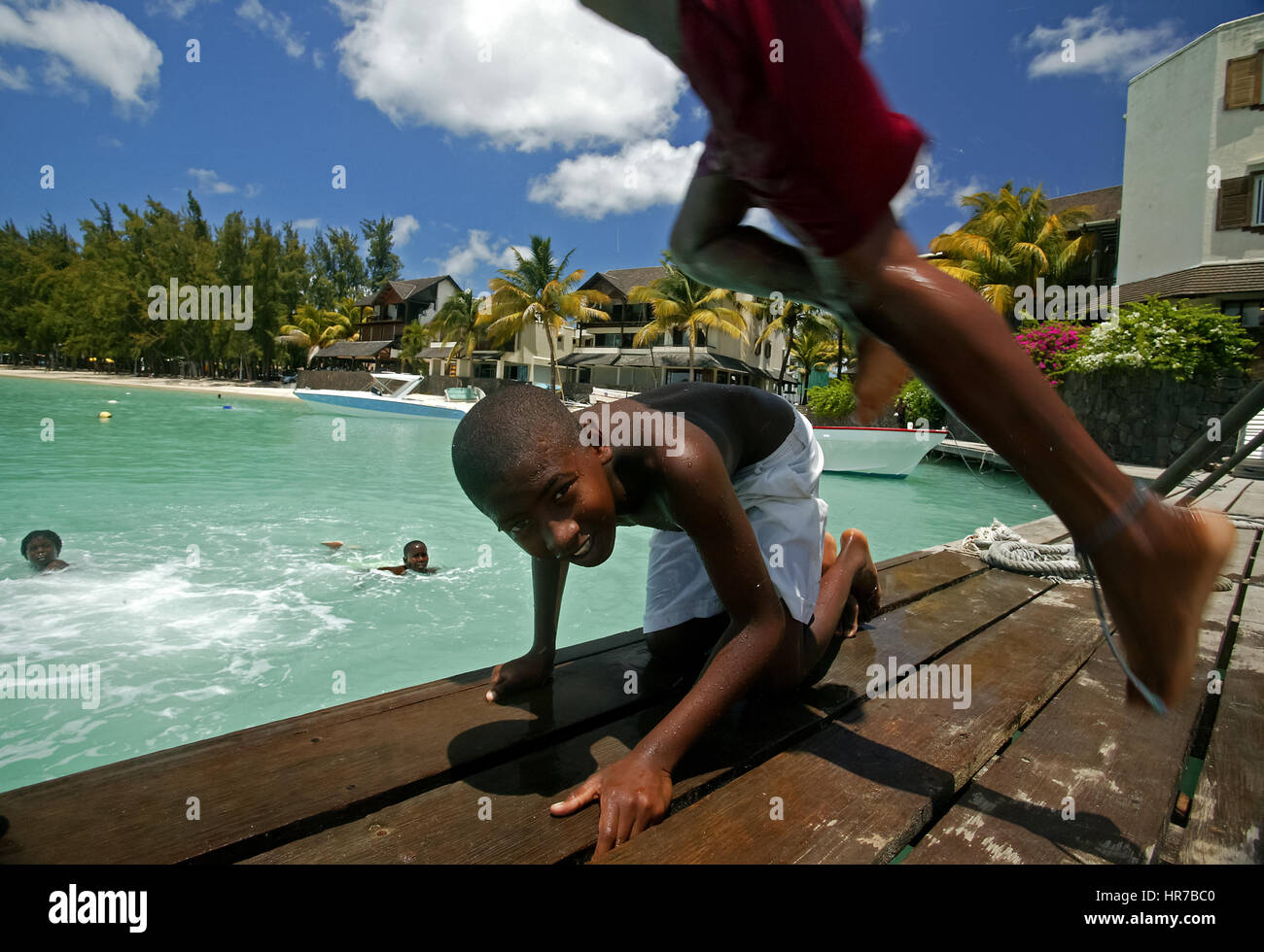Native children jumping water hi-res stock photography and images - Alamy