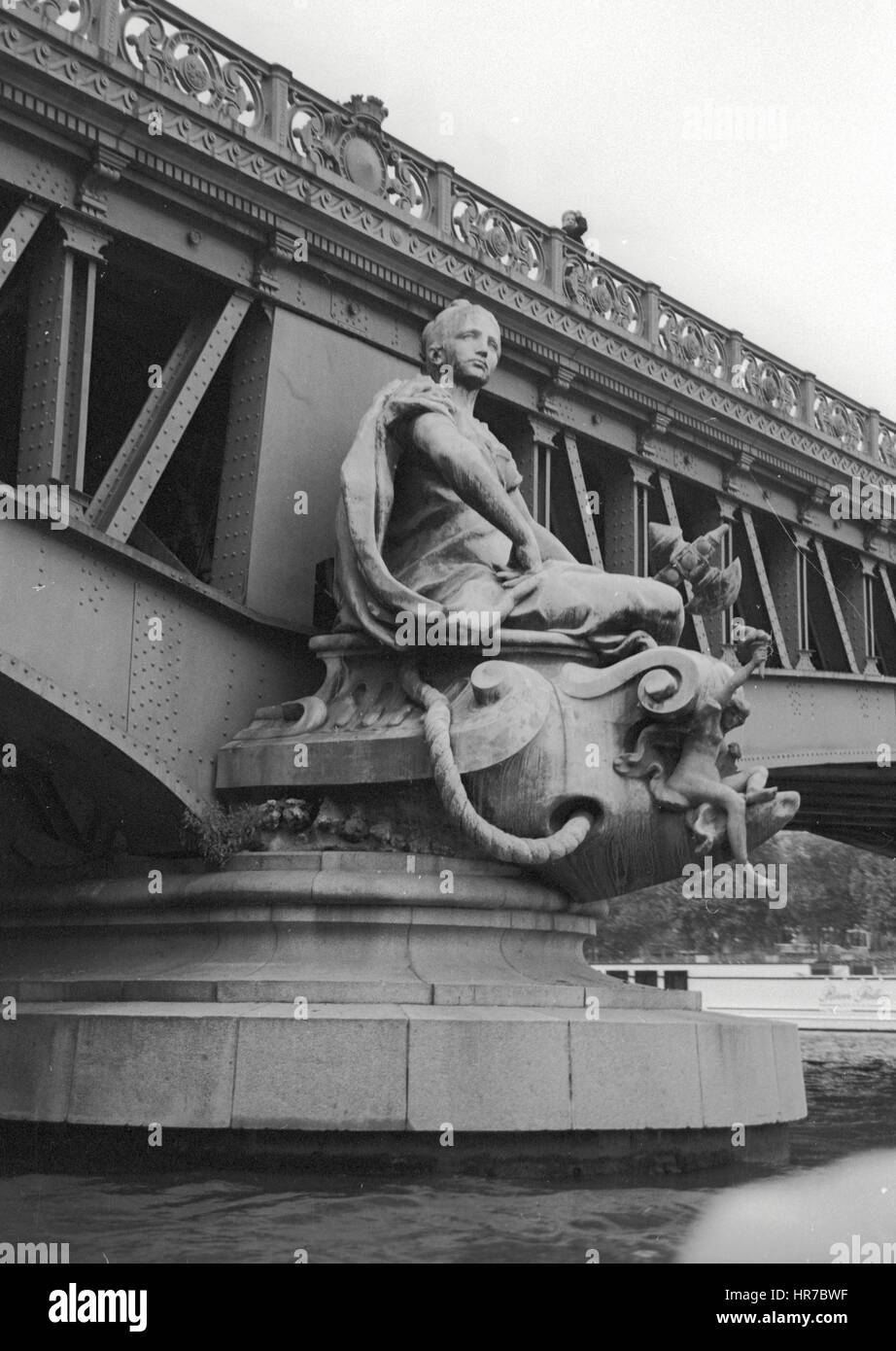 The Mirabeau Bridge over the Seine River feature bronze sculptures on ...