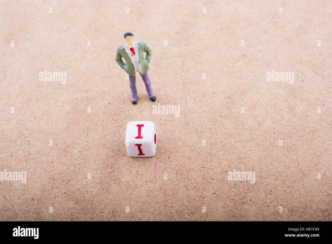 Figurine and the colorful alphabet letter cube I Stock Photo - Alamy