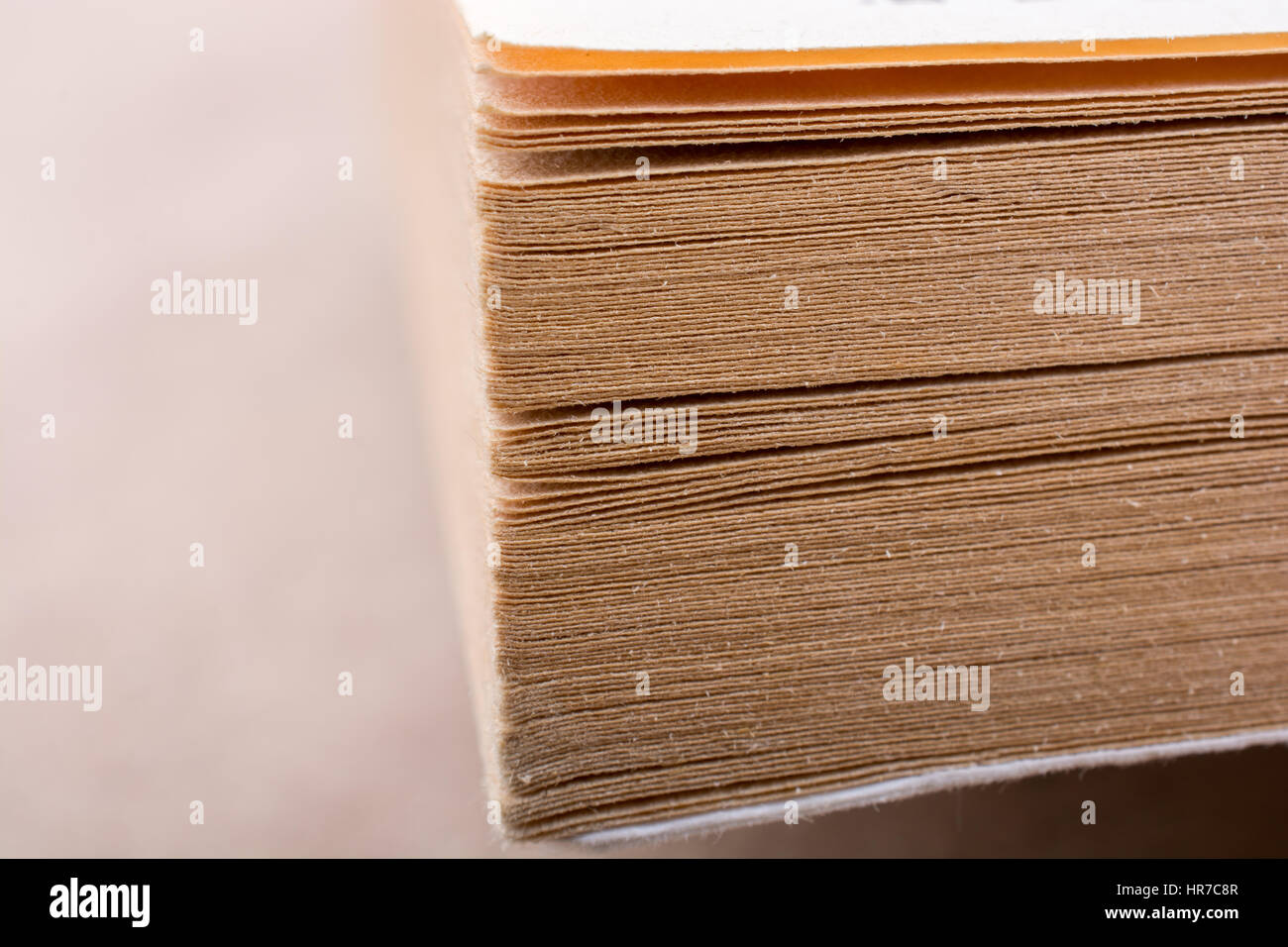 Book pages partly in view on white background Stock Photo - Alamy