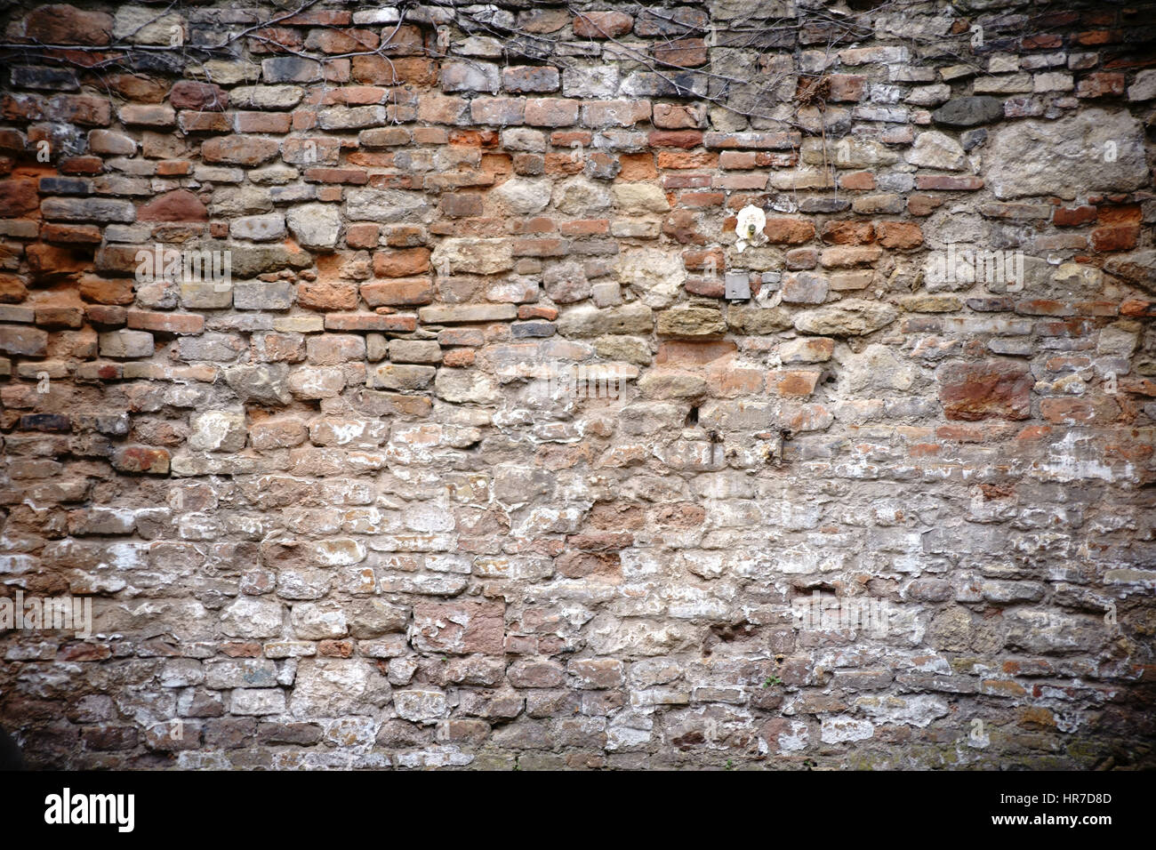 A striking wall of displaced and broken bricks Stock Photo - Alamy