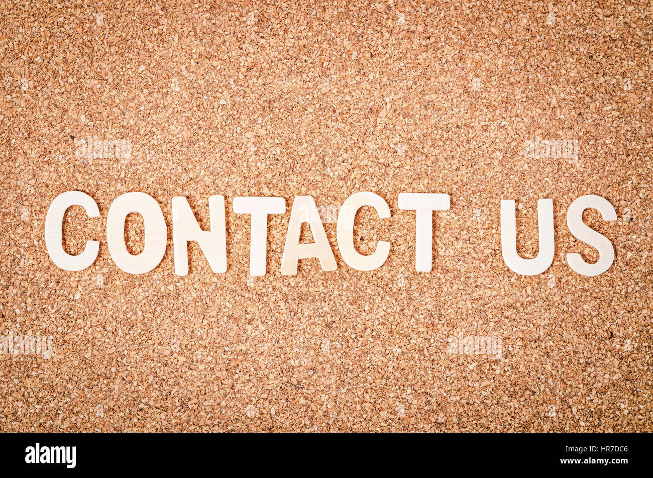 Contact us word on wooden background Stock Photo - Alamy