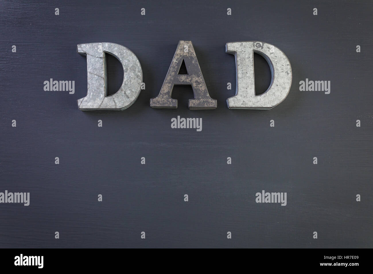 Metal letters DAD on a painted wood background Stock Photo - Alamy
