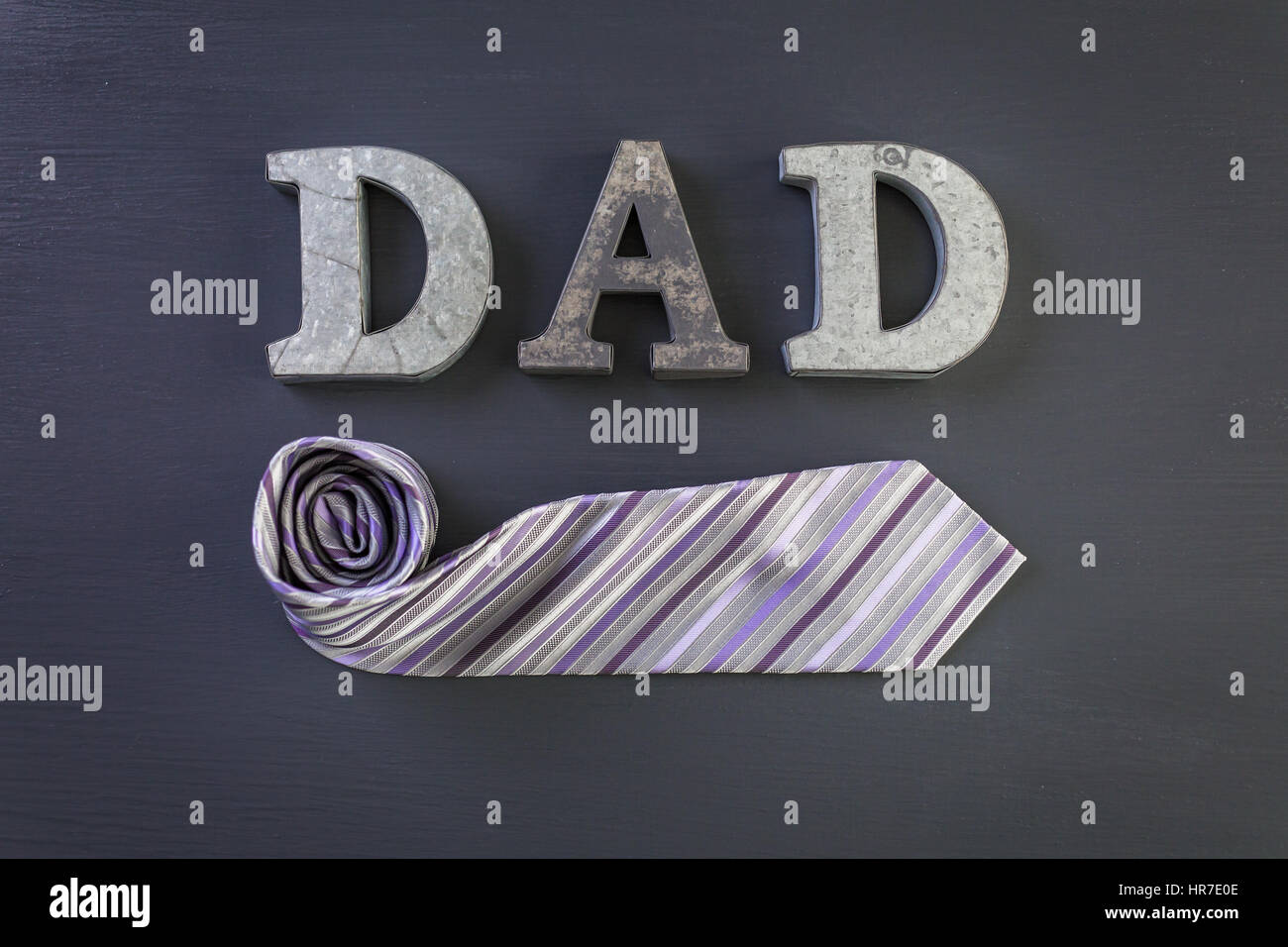 Metal letters DAD on a painted wood background Stock Photo - Alamy