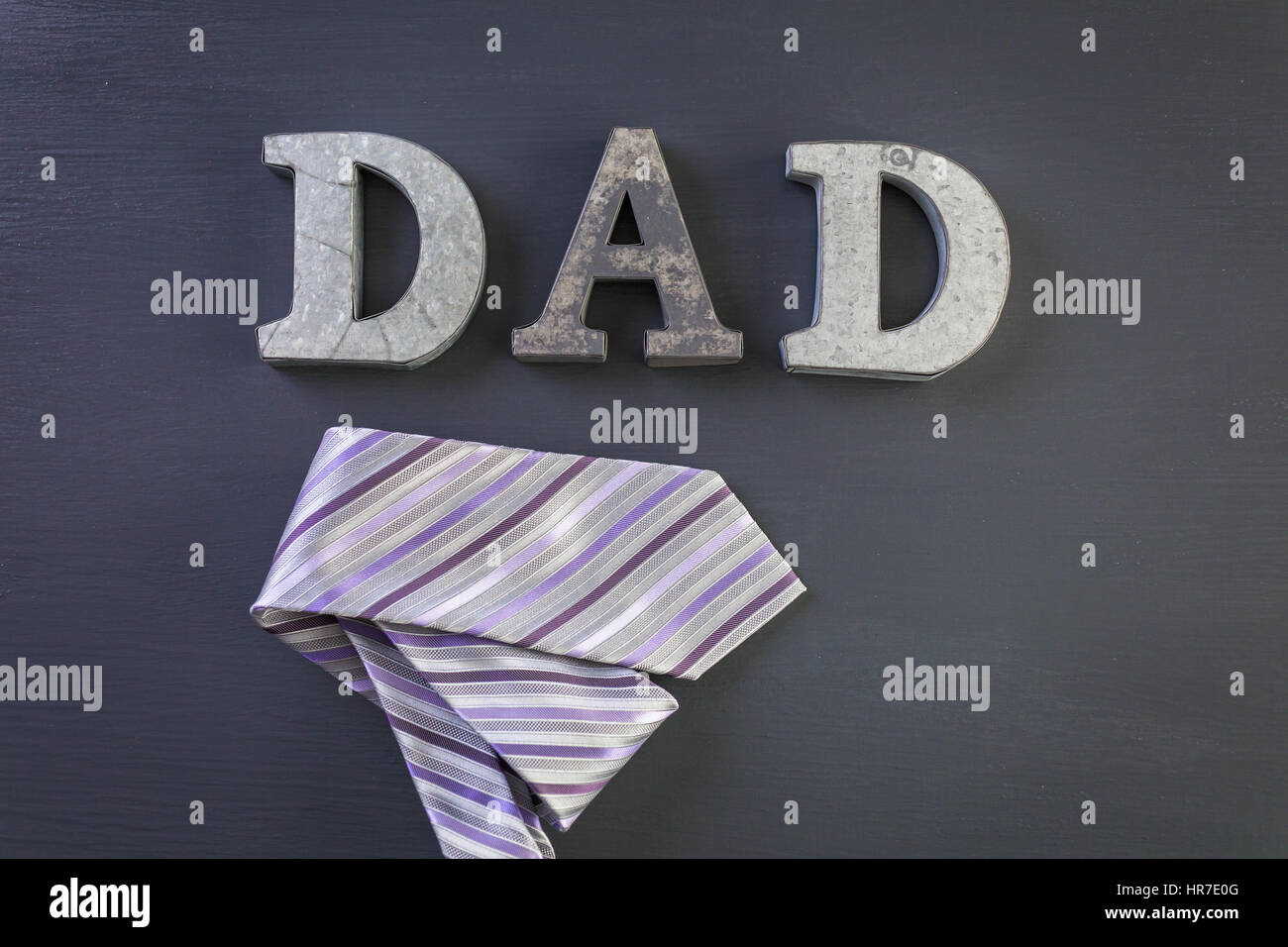 Metal letters DAD on a painted wood background Stock Photo - Alamy